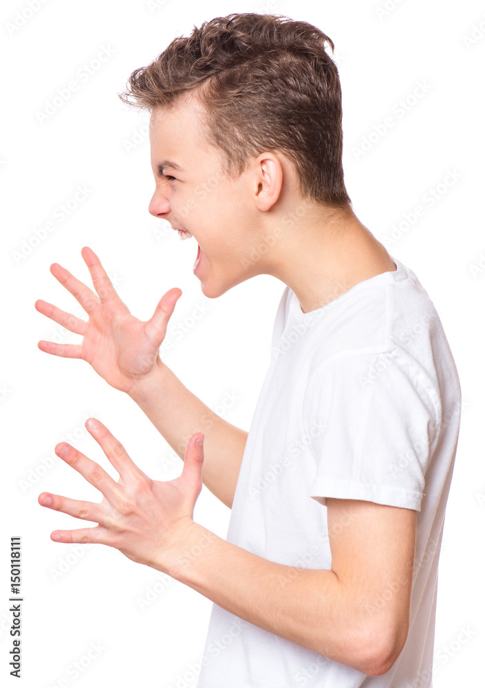 Emotional portrait profile of angry teen boy in white t-shirt. Child ...
