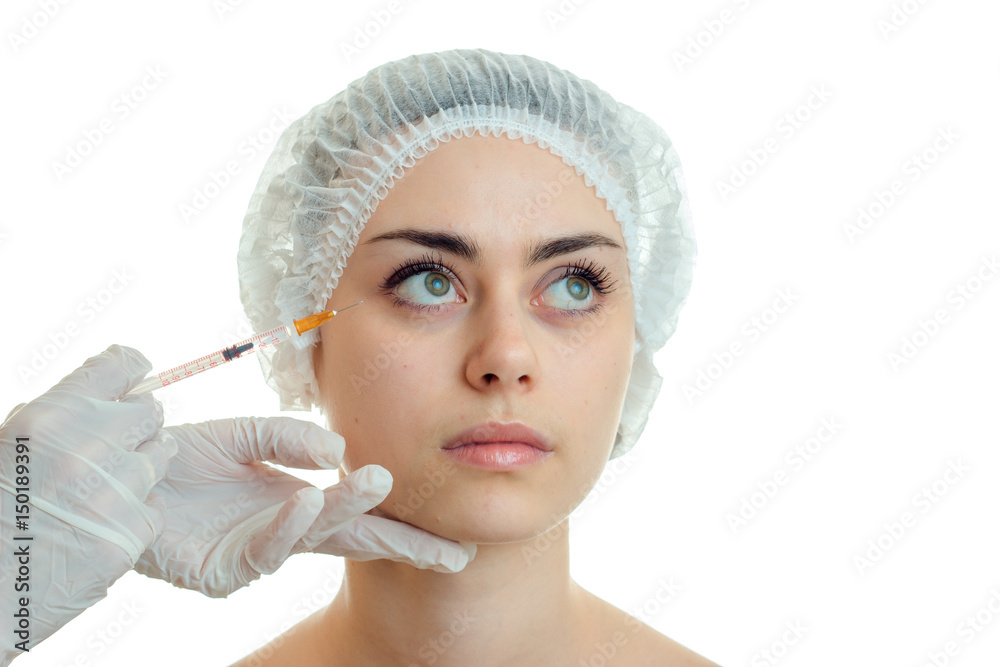 Portrait of a pretty young girl in a special hat on your head which ...