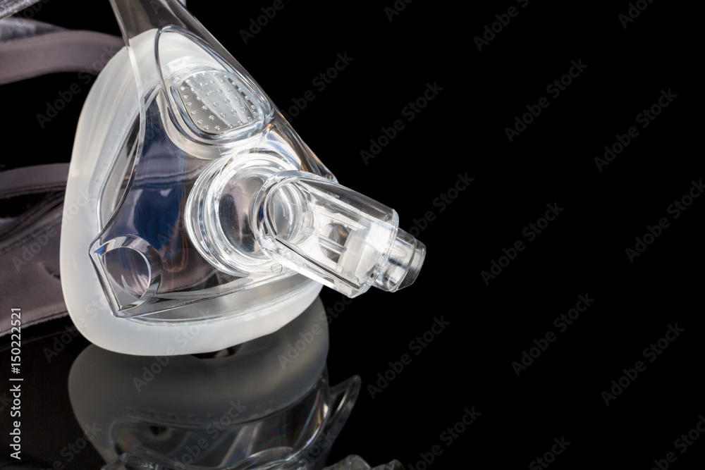 Sleep apnea CPAP mask on the black background Stock-Foto | Adobe Stock