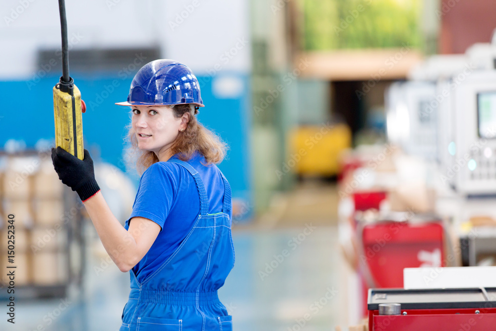 Factory female worker operating workshop gantry crane Stock Photo ...