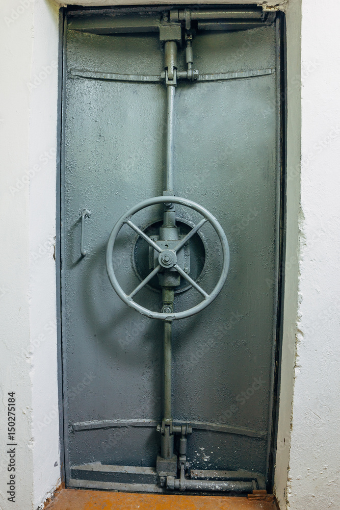 Opened hermetic door of an abandoned Soviet bomb shelter, an echo of ...