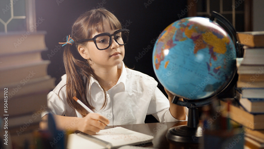 Eight years thoughtful school girl studying process, table place with ...