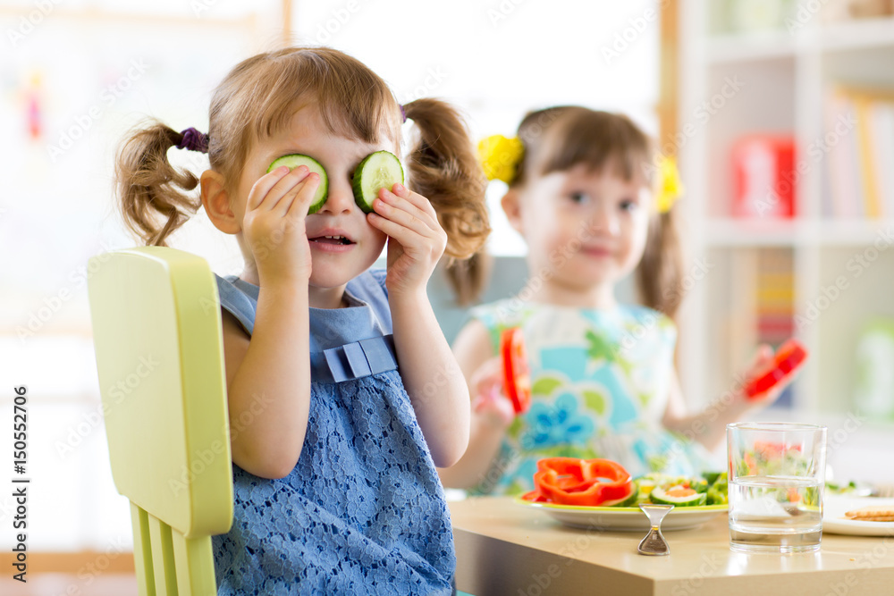 kids eating healthy food in kindergarten or at home Stock Photo | Adobe ...