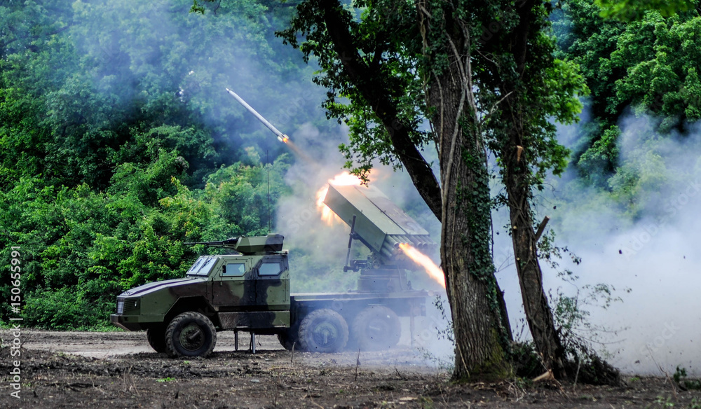 Multiple rocket launcher firing action Stock Photo | Adobe Stock