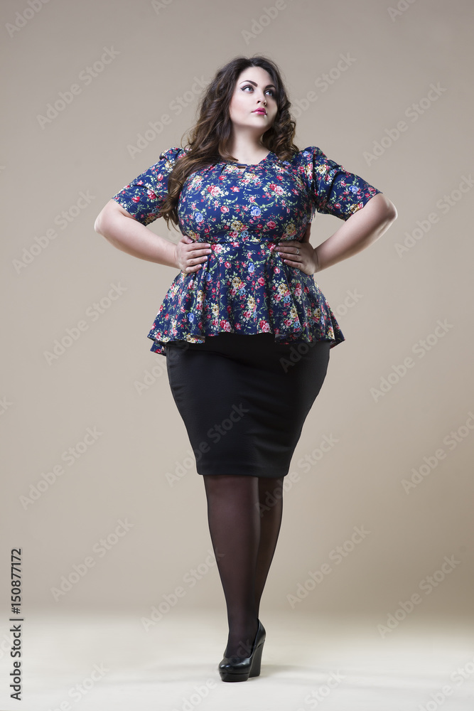 Plus size fashion model in casual clothes, fat woman on studio ...