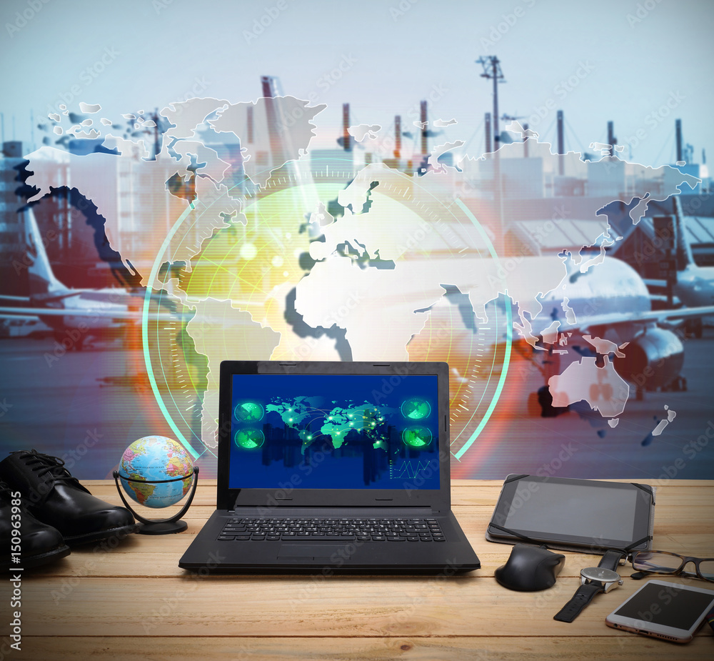 Office workplace with laptop and smart phone on wood table with airport ...