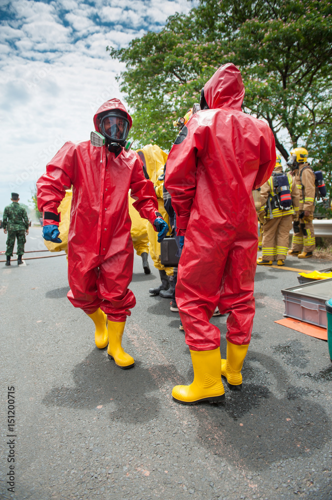 firefighter with hazmat (hazardous material) suits to protect them from ...