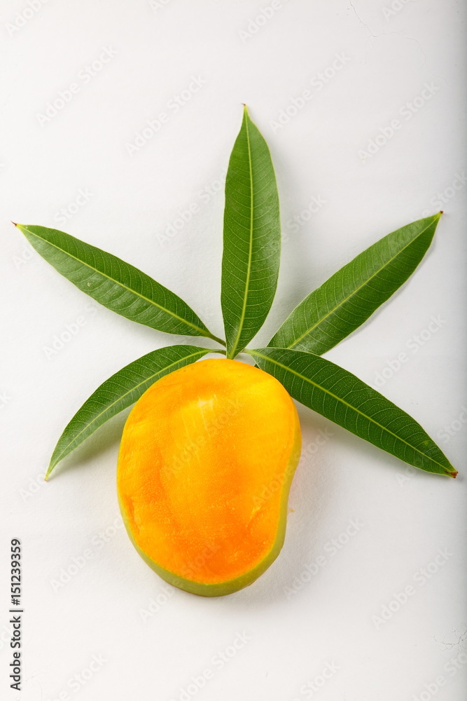 Mango shape with sliced fruit with leaves Stock Photo | Adobe Stock