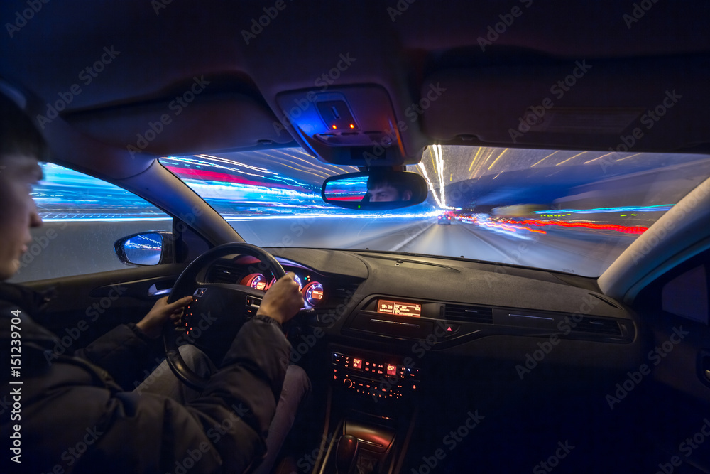 City road view from inside car natural light street and other cars is ...