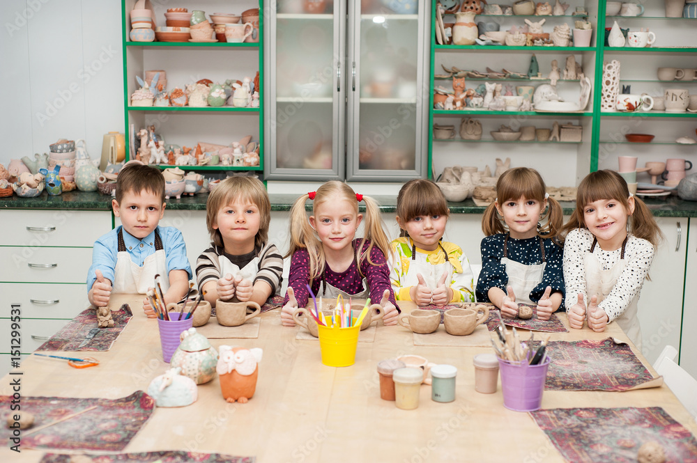 Little children in the lessons of molding from clay Stock Photo | Adobe ...