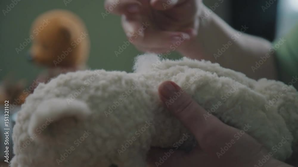 Process of stuffing a soft toy filler. Filler for soft toys. The ...
