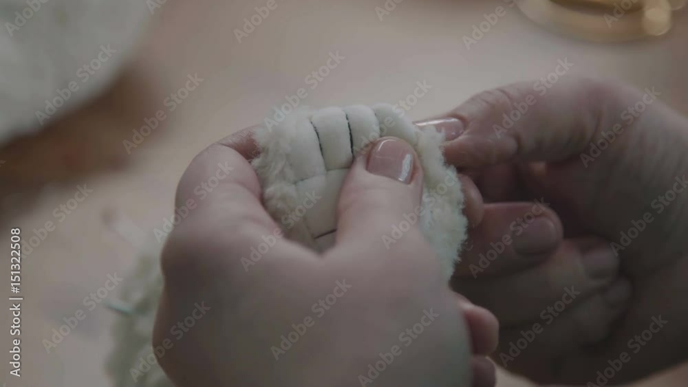 Teddy bear: the process of creation. Sewing a soft toy: a woman doing a ...