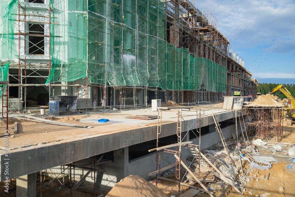 Close-up office and residential building under construction with safety ...