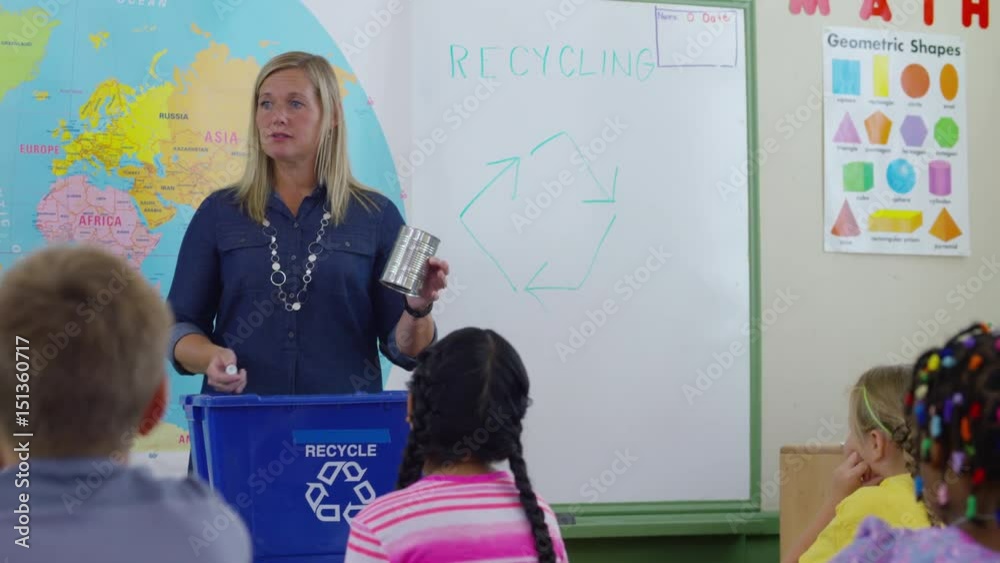 Vidéo Stock Teacher giving recycle lesson in school classroom | Adobe Stock