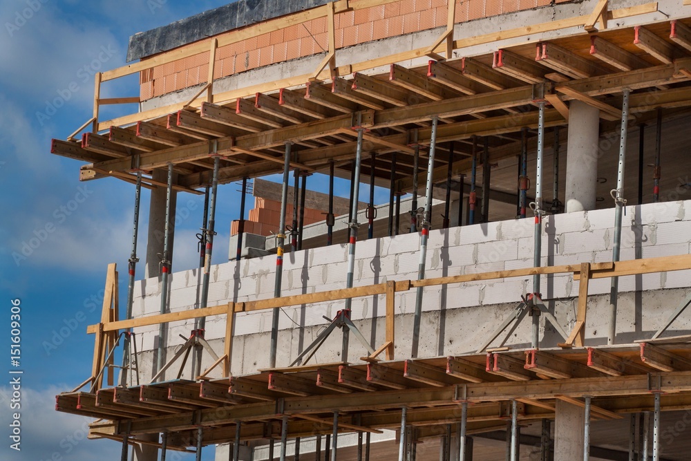 Scaffolding and concrete formwork. Building site of an office building ...