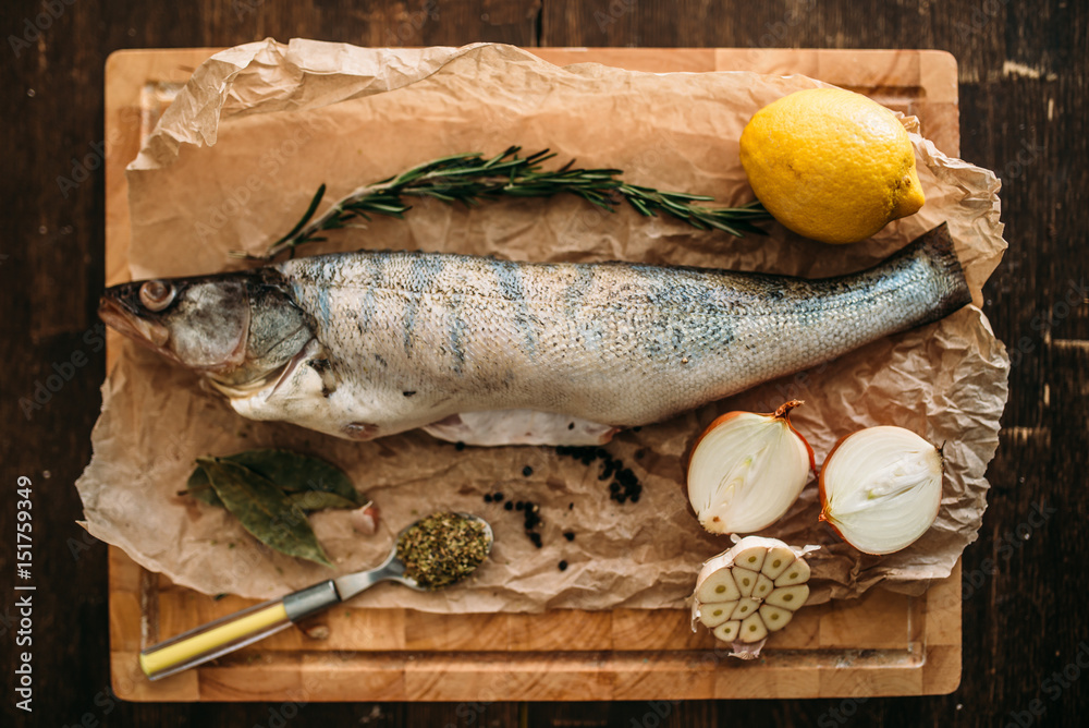 Fish preparation ingredients on cutting board Stock Photo | Adobe Stock