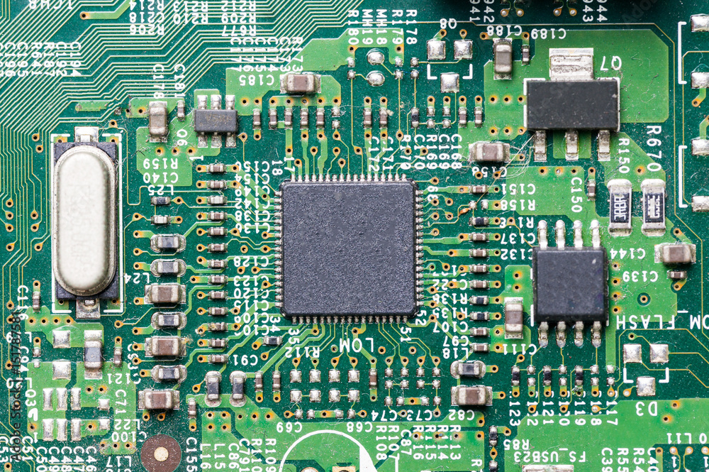 Green computer mainbaord circuit and chip. Stock Photo | Adobe Stock