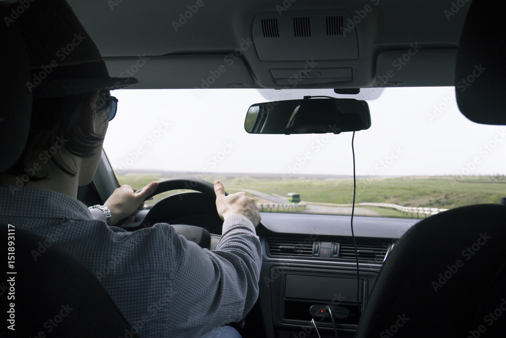 video recorder driving a car on highway. hidden camera. The man in the ...