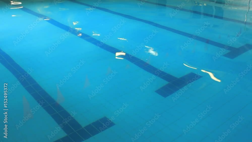 Swimming path in waterpool. Waves surface of water in swimming pool ...