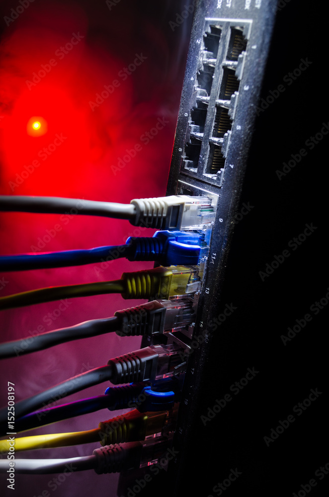 Network switch and ethernet cables, symbol of global communications ...