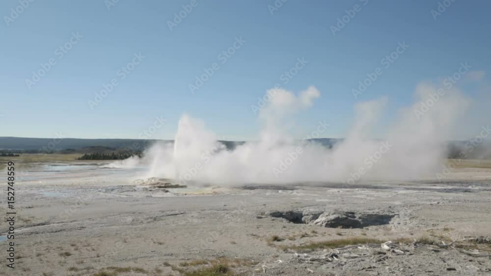 wide shot of a geyser erupting in yellowstone Stock Video | Adobe Stock