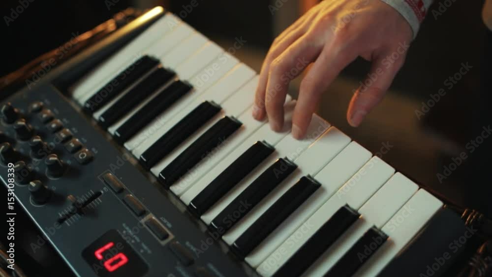 Unrecognisabl male in kosovorotka shirt hand fast tapping on keys of ...