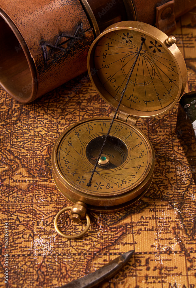 Old vintage retro compass on ancient world map. Vintage still life ...