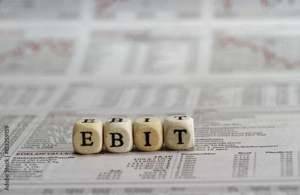EBIT word built with letter cubes on newspaper background Stock Photo ...