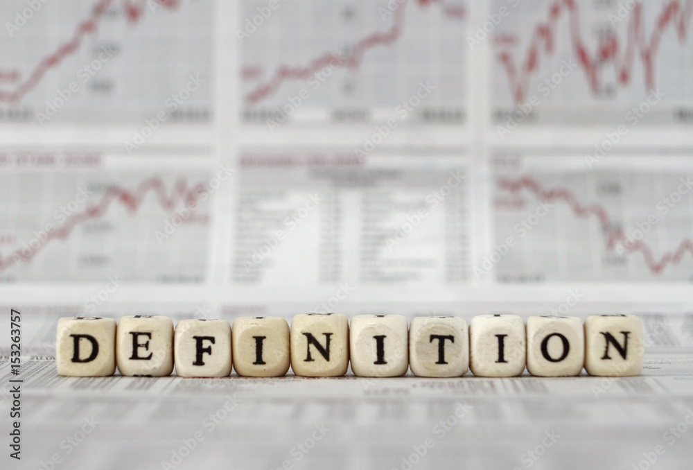 Definition word built with letter cubes on newspaper background Stock ...