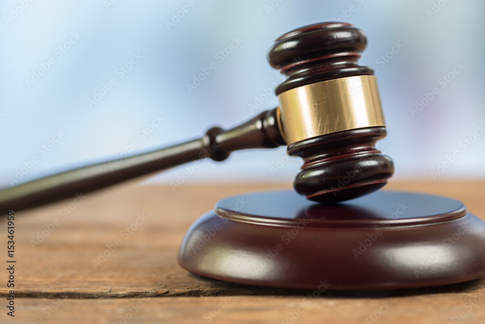 Judge hammer on blurred background Stock Photo | Adobe Stock