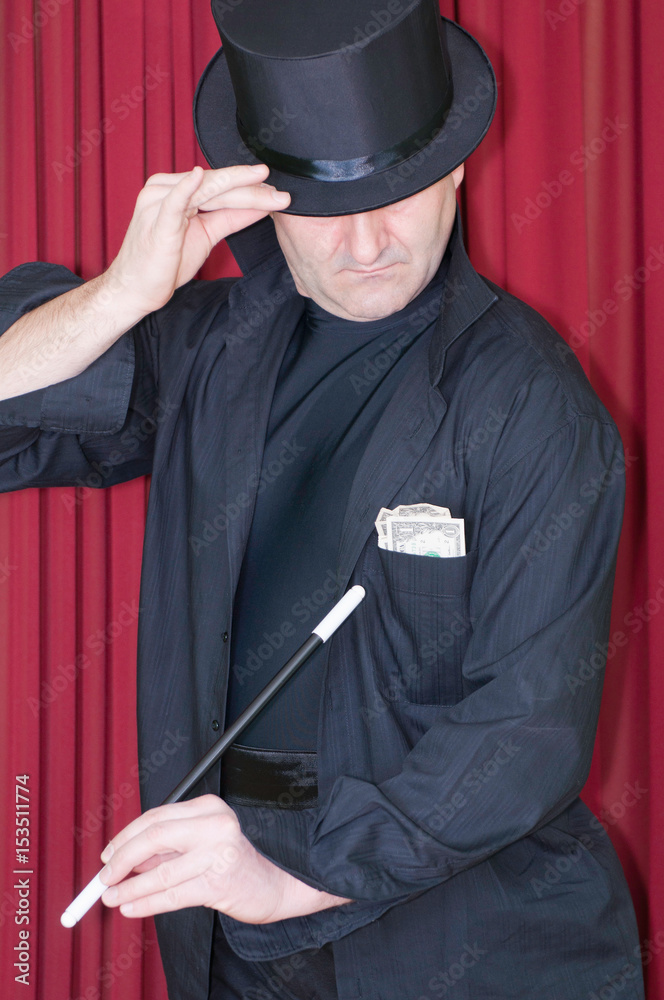 Magician performing on stage Stock Photo | Adobe Stock