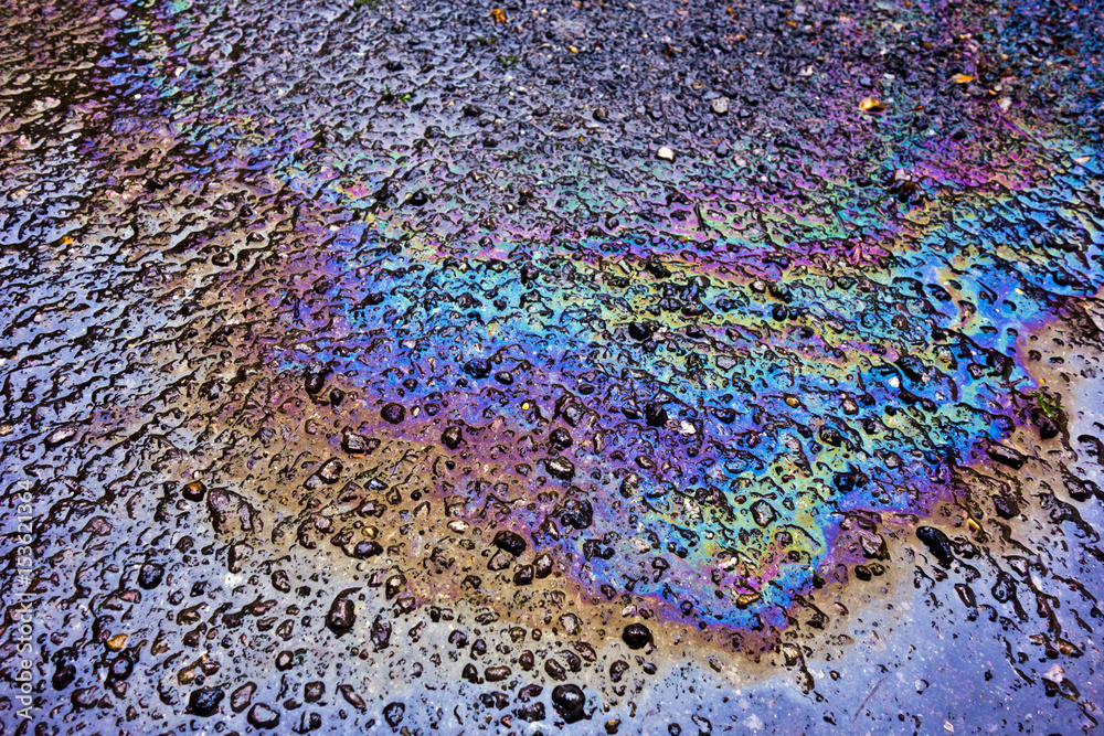 Petrol Oil Spill on Wet Ground Rainbow Stock Photo | Adobe Stock