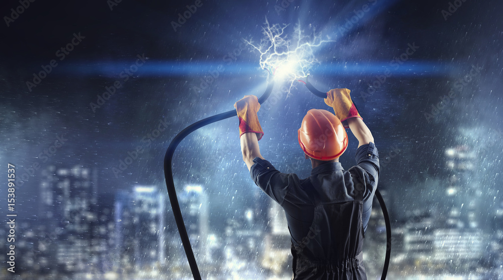 Fixing electricity cut . Mixed media Stock Photo | Adobe Stock