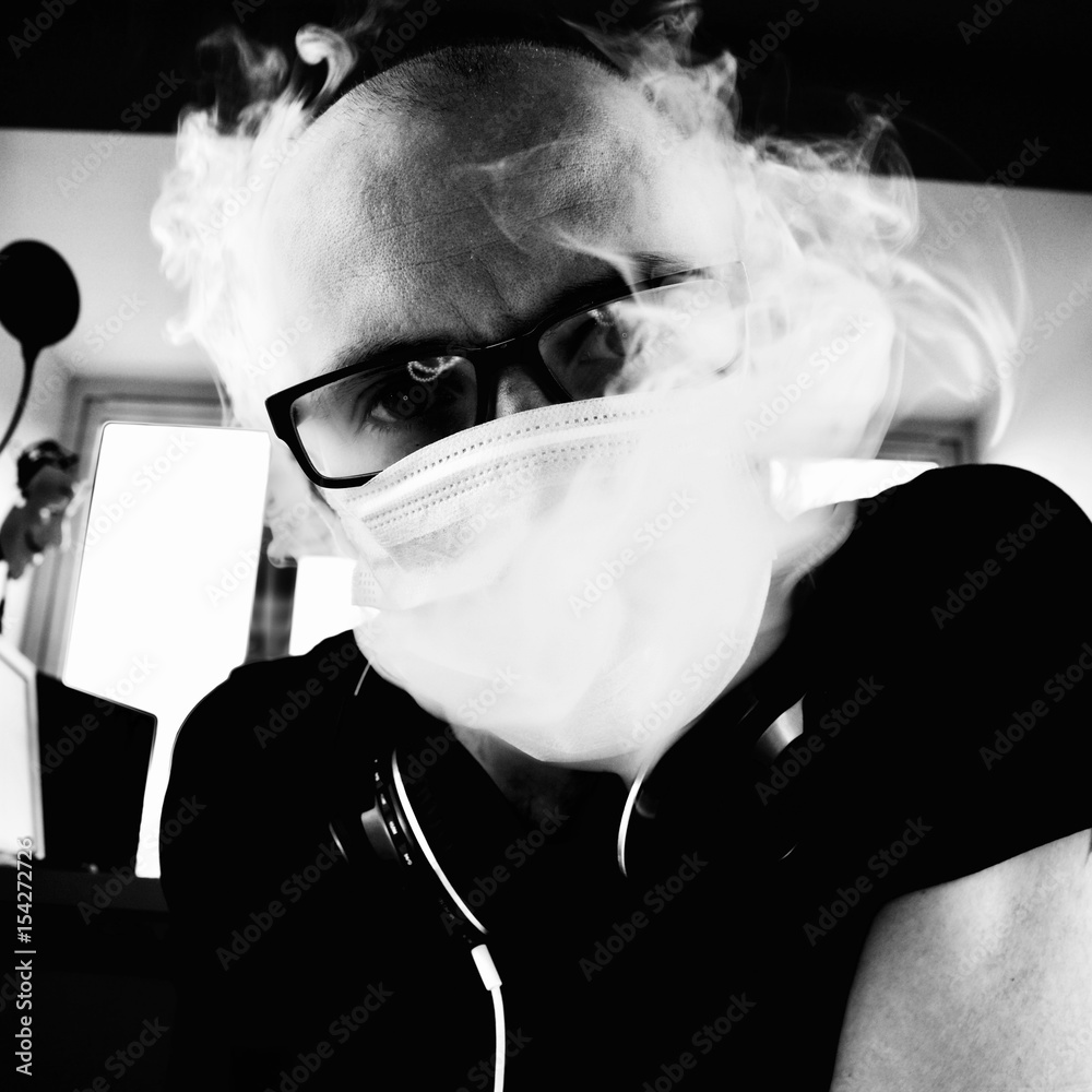 Man smoking with mask Stock Photo | Adobe Stock