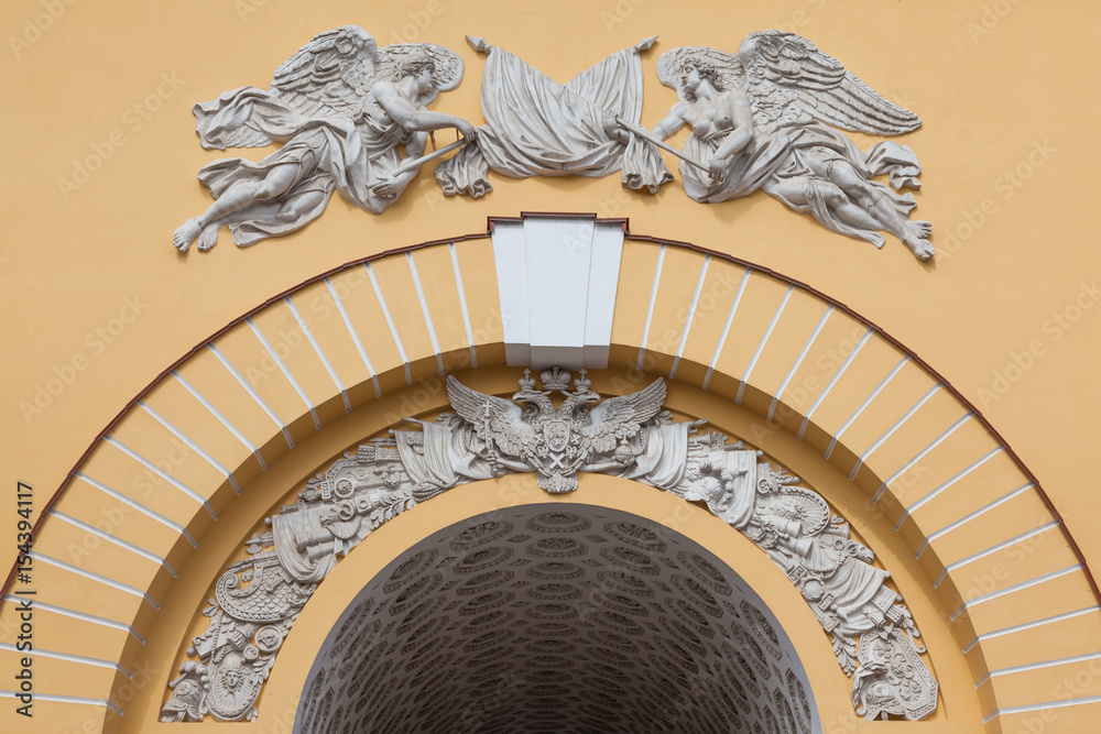 Angels and the coat of arms of Russia over the central arch of the ...