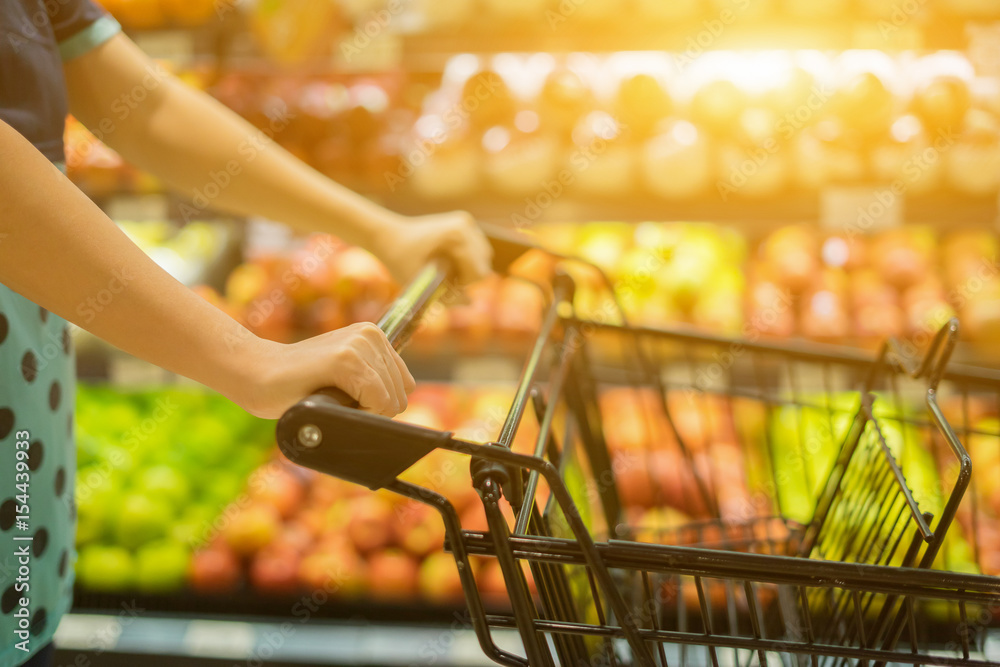 Female Hand Close Up With Shopping Cart in a Supermarket Walking Trough ...