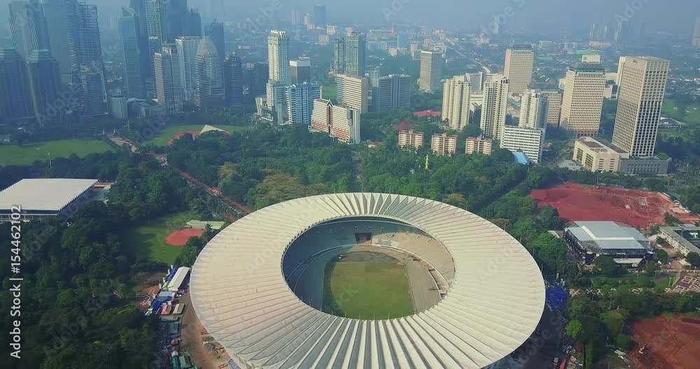 Video footage of aerial view of football stadium and skyscrapers in ...
