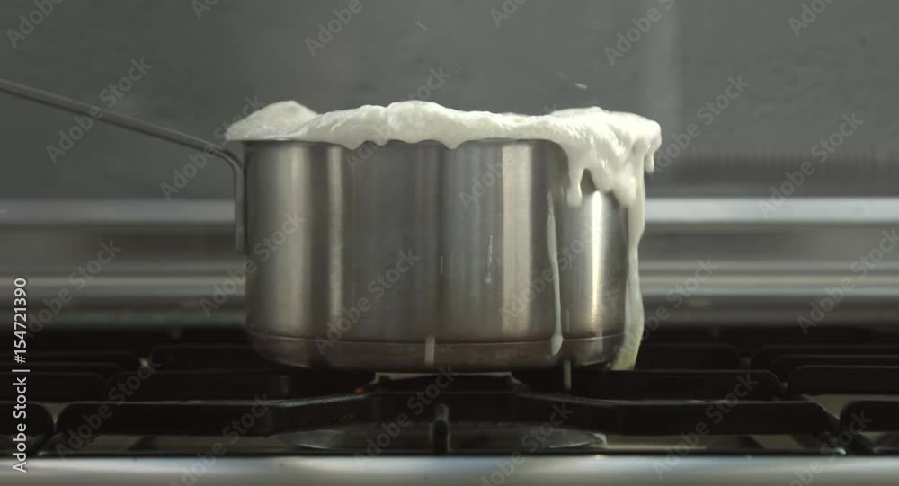 Close up the overboiled milk Stock Video | Adobe Stock