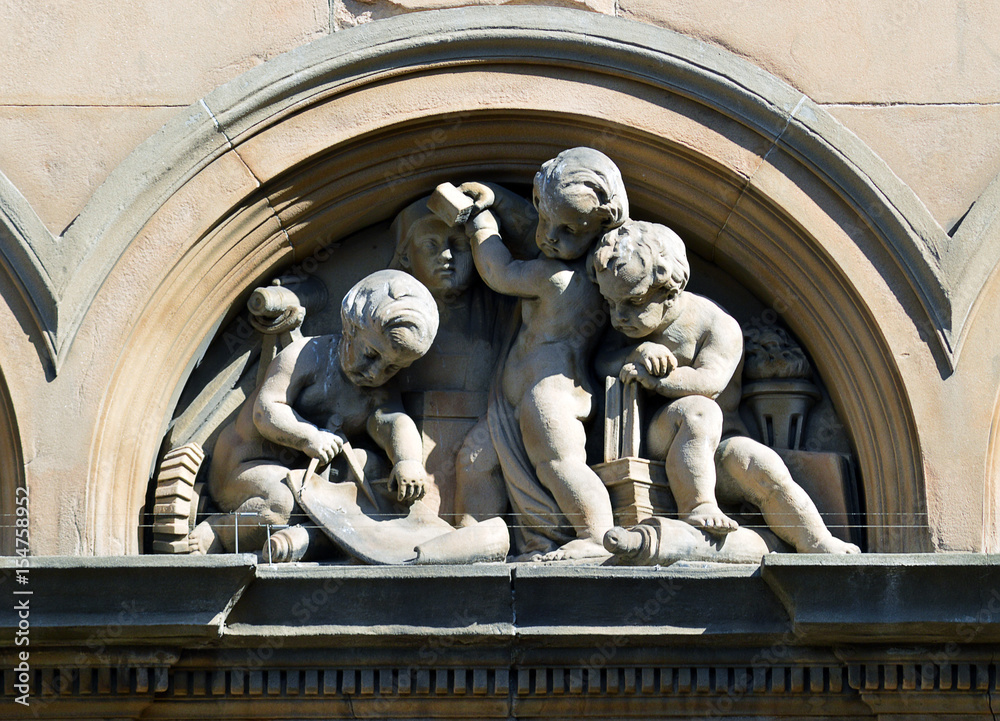 Putti at work: sculptures of cherubs building in arcade, Glasgow ...