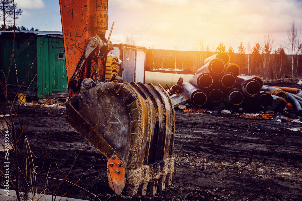 The excavator is engaged in loading the earth and digging the earth ...