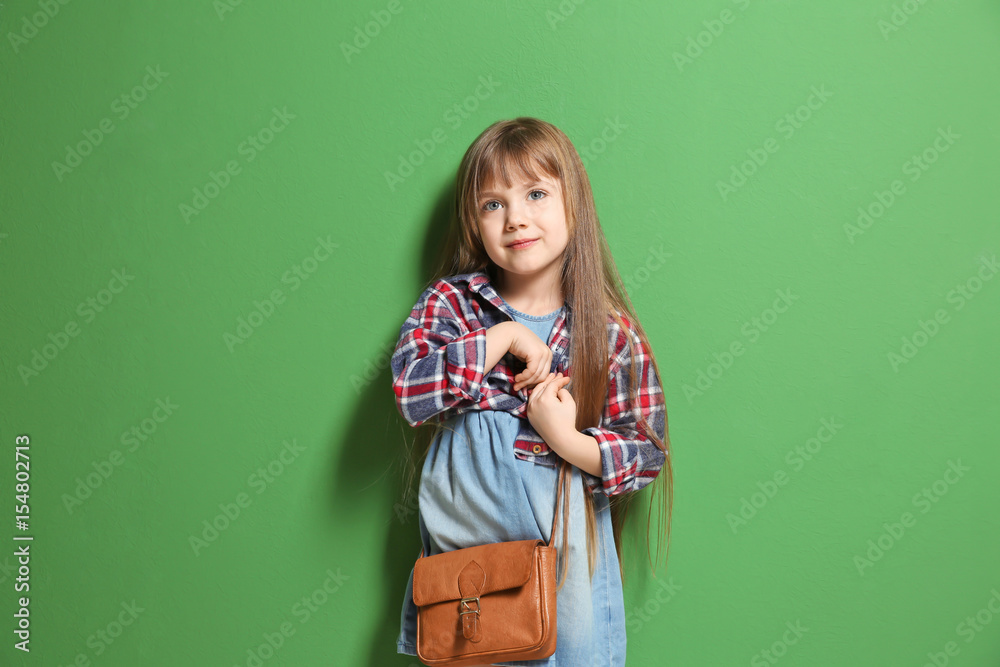 Cute little girl on color background. Fashion concept Stock Photo ...