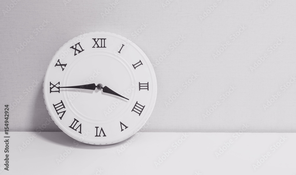 Closeup white clock for decorate show a quarter to four o'clock or 3:45 ...