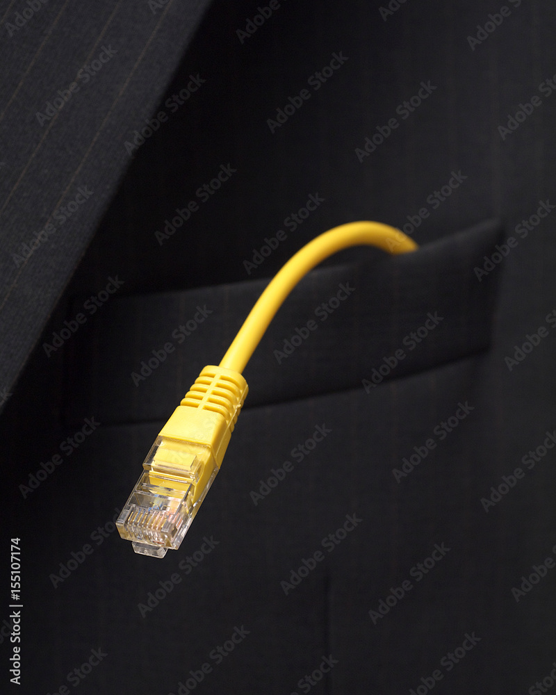 yellow RJ45 network ethernet cable hanging from a business suit pocket ...