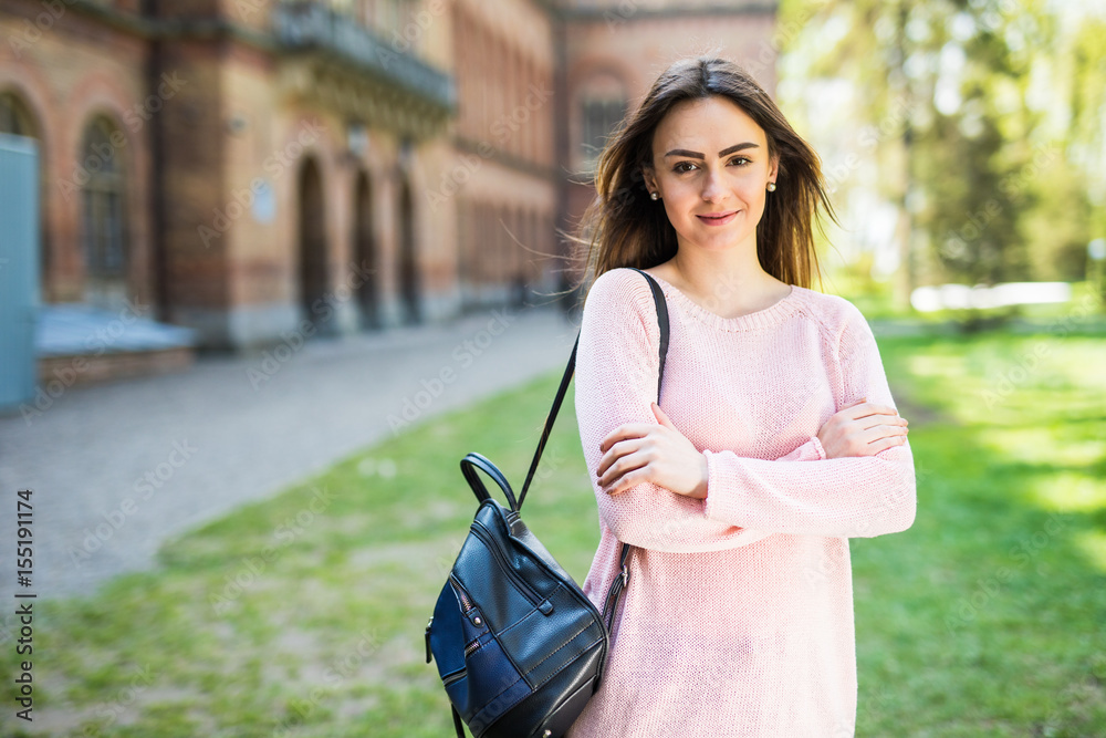 Student girl outside in summer park smiling happy. Caucasian college or ...