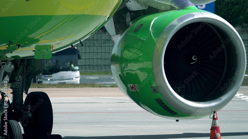 Operating turbine engine of an aircraft at the airport Stock Photo ...