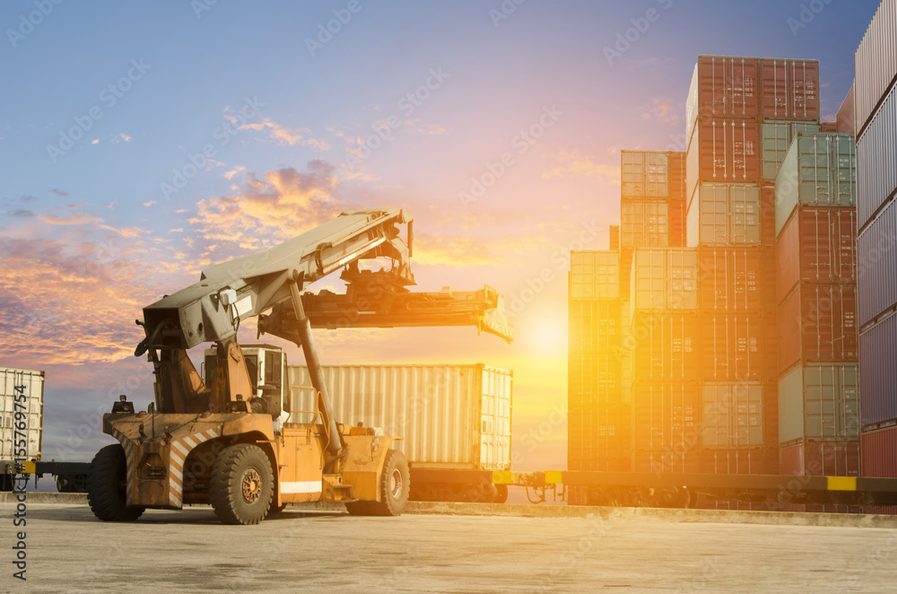 stacker and container train freight for import export concept in sunset ...