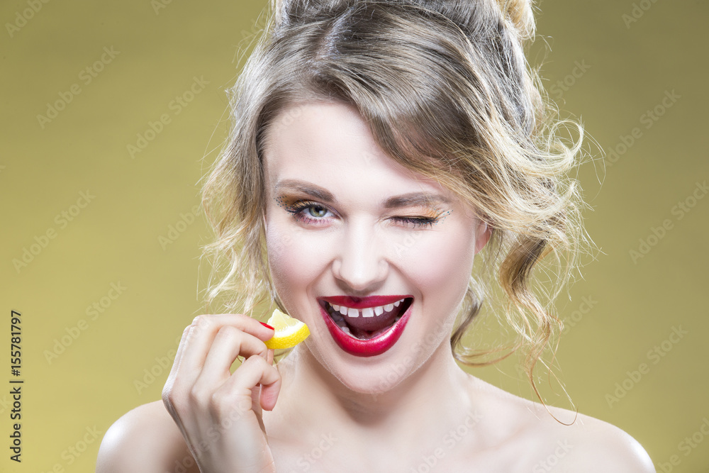 Portrait of Sexy Caucasian Blond Girl Eating Tiny Lemon Piece ...