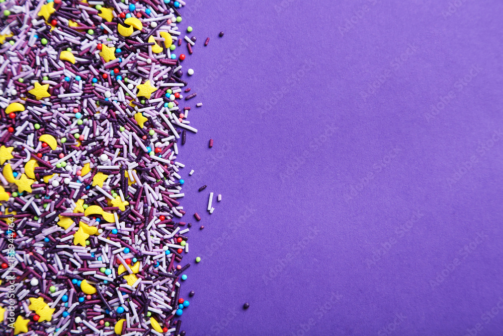 Colorful sprinkles on the purple background Stock Photo | Adobe Stock