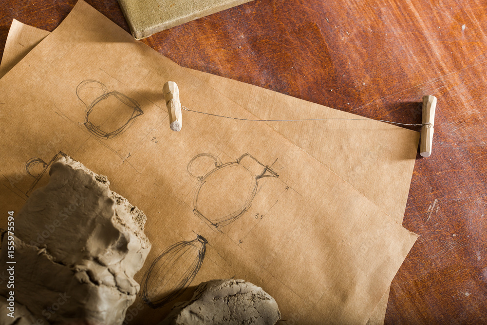 potter, clay workshop, ceramics art concept - closeup on two parts of ...