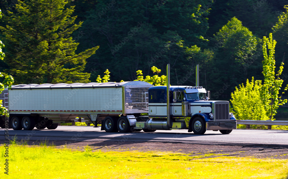Classic semi truck big rig with two trailers on highway Stock Photo ...